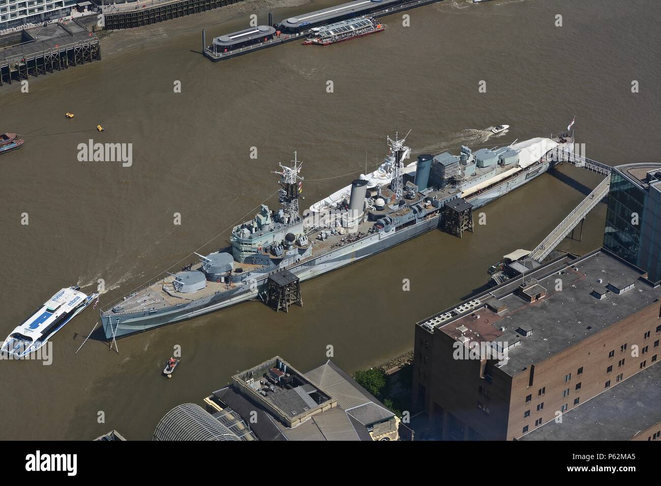 HMS Belfast docked in the River Thames at the Imperial War Museum ...