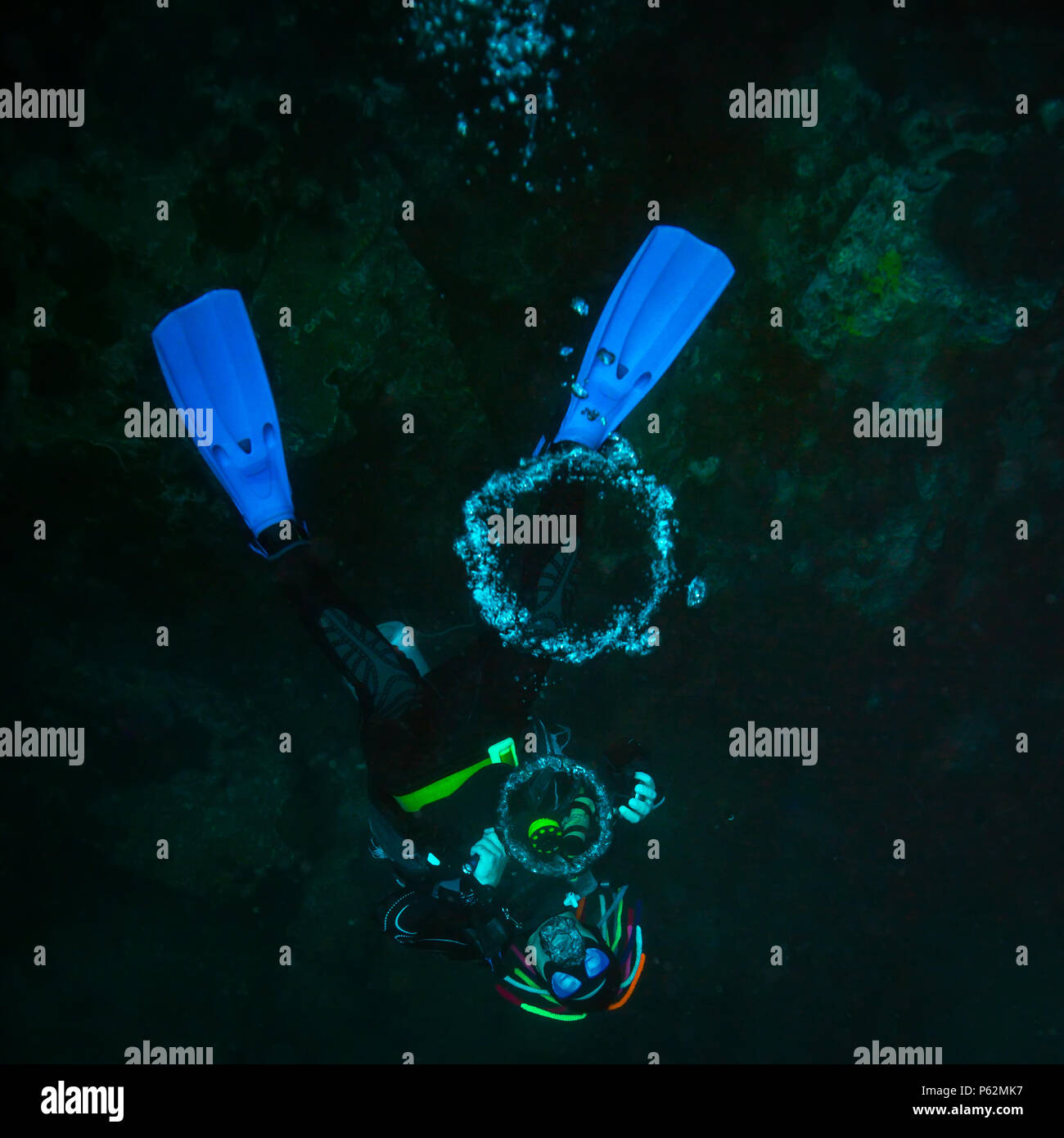 The scuba diver blows the air rings Stock Photo - Alamy