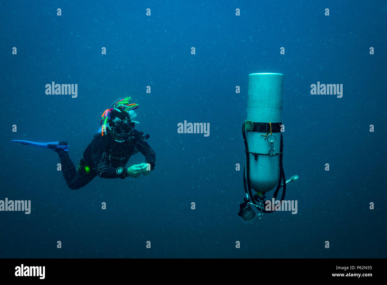 Scubadiver in a sidemount configuration of equipment Stock Photo - Alamy
