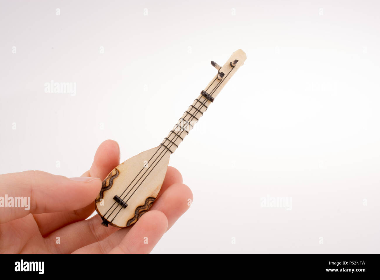Hand holding the classic turkish instrument Saz Stock Photo - Alamy