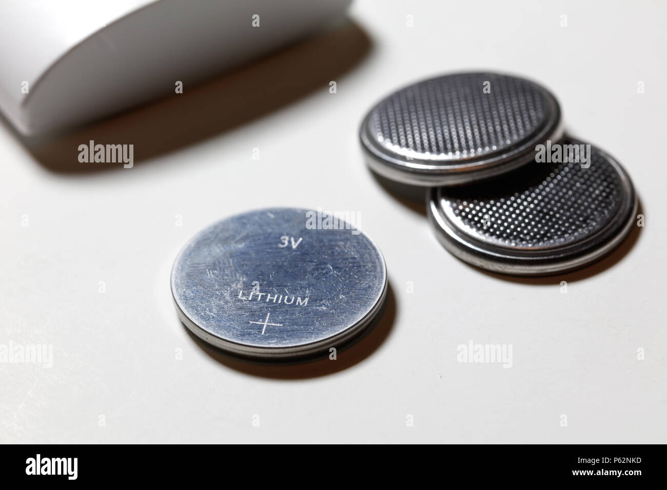 Silver Button Cell Battery On White Background Stock Photo - Alamy