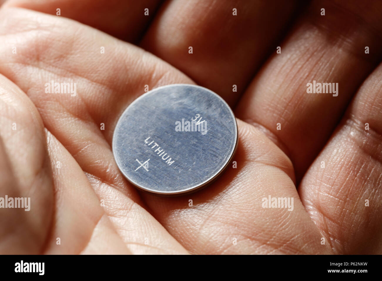 Silver Button Cell Battery On White Background Stock Photo - Alamy