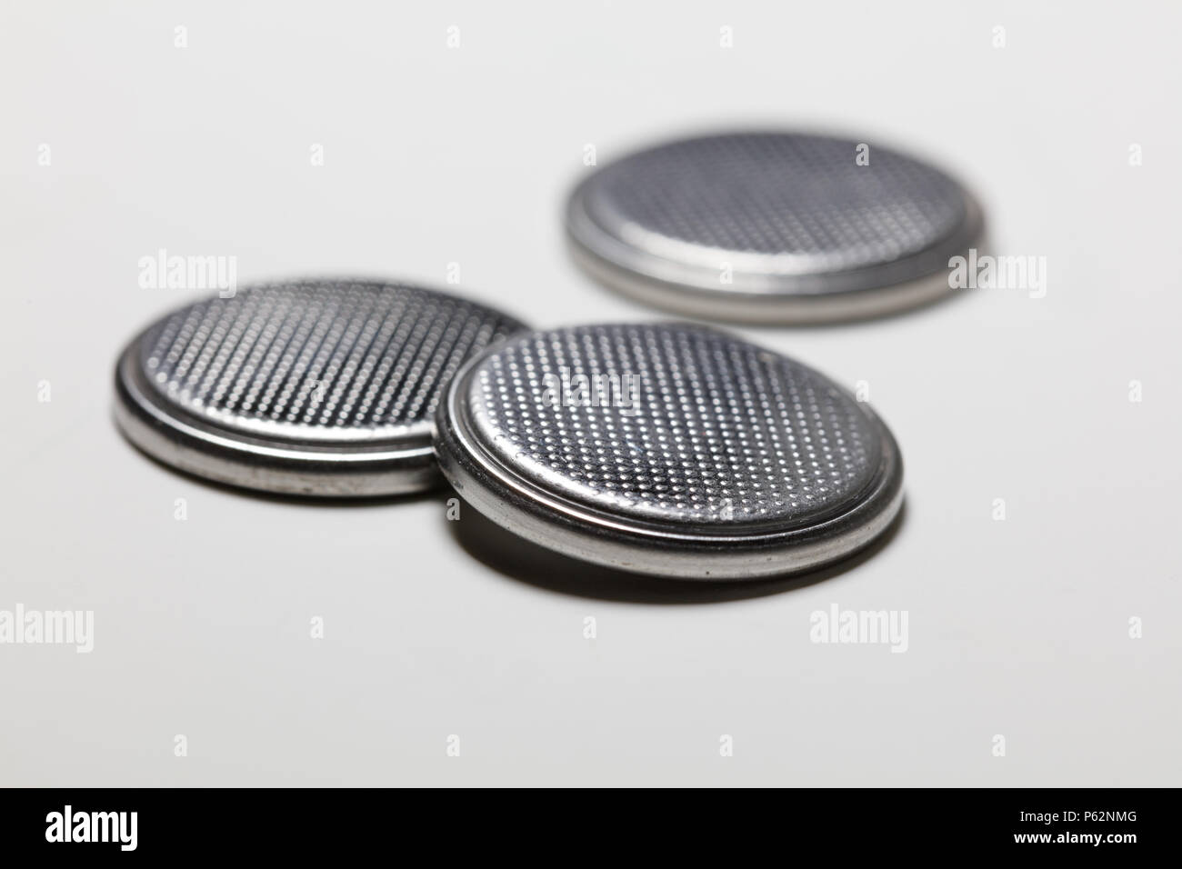 Silver Button Cell Battery On White Background Stock Photo - Alamy