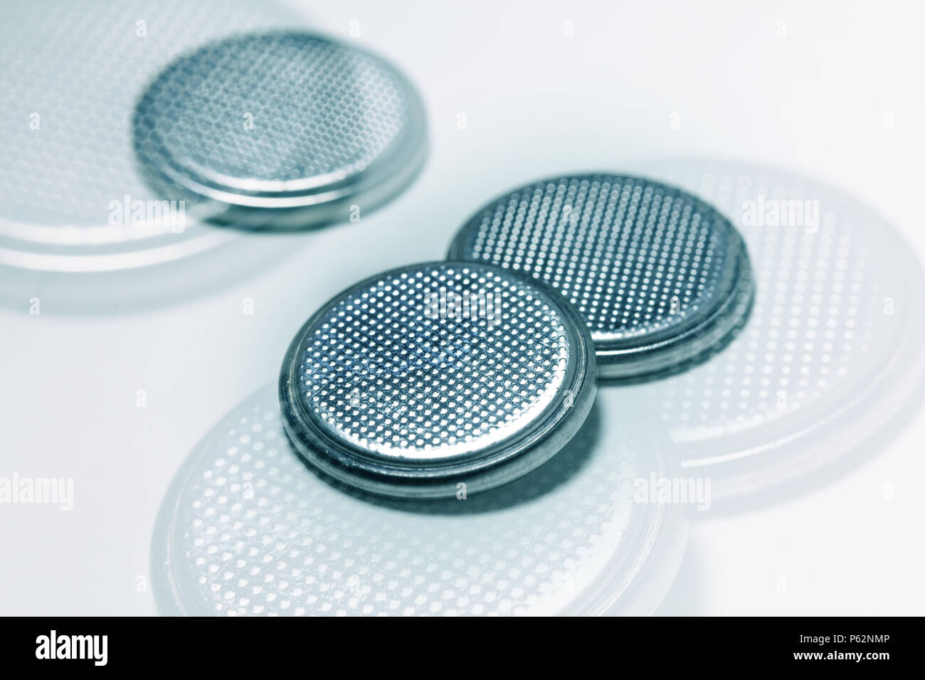 Silver Button Cell Battery On White Background Stock Photo - Alamy