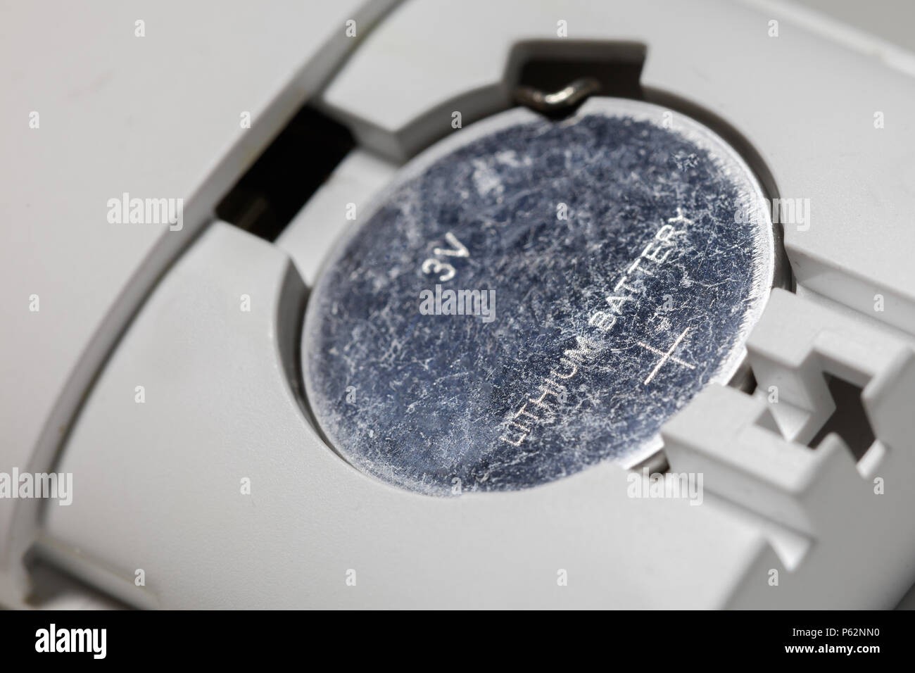 Silver Button Cell Battery On White Background Stock Photo - Alamy