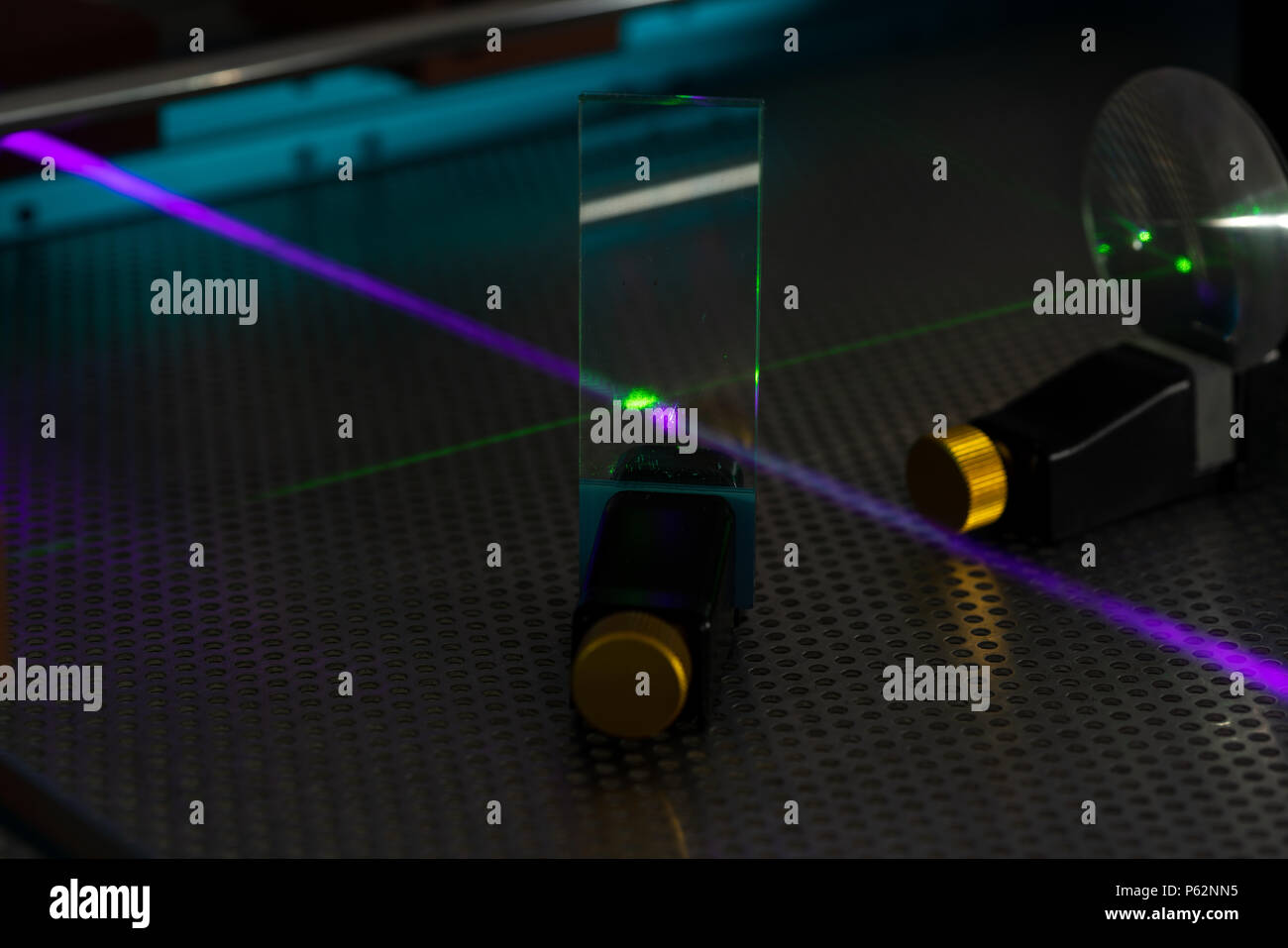 Experiment in photonic laboratory with laser Stock Photo - Alamy