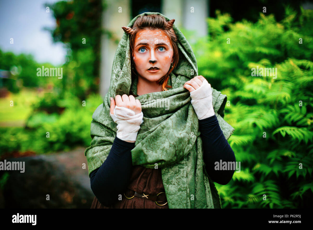 A Renaissance fair actor dressed in costume as a woodland creature ...