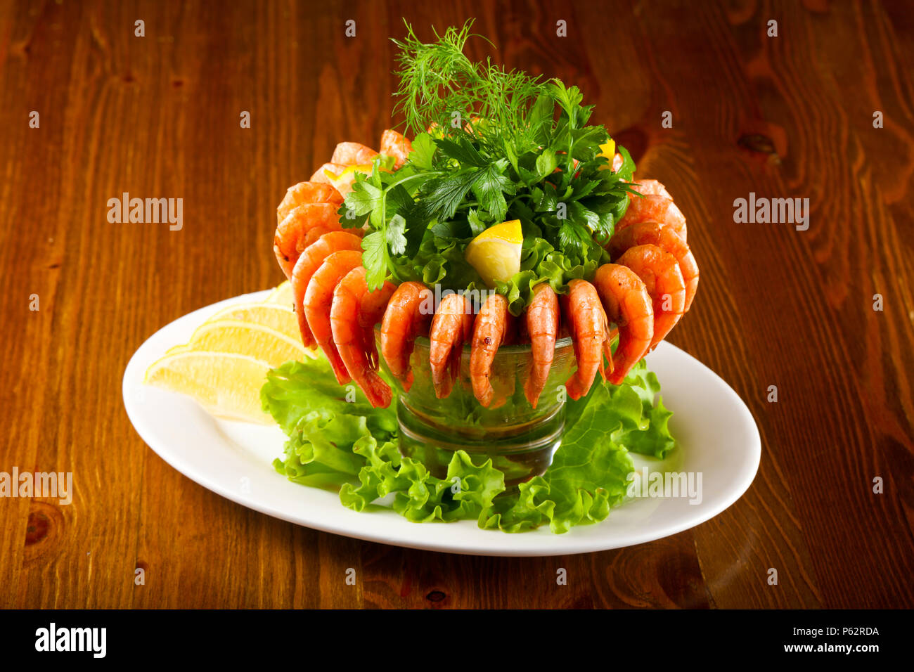 Prawn cocktail served lemon and parsley Stock Photo - Alamy
