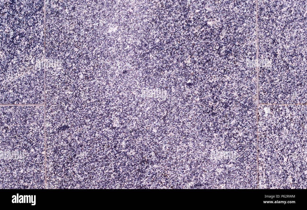 granite texture with gray base and black spots. background, geological ...