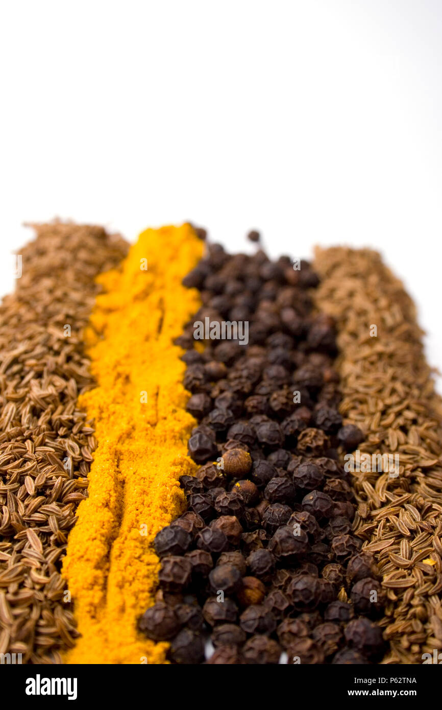 Heaps of various ground spices on white background Stock Photo - Alamy