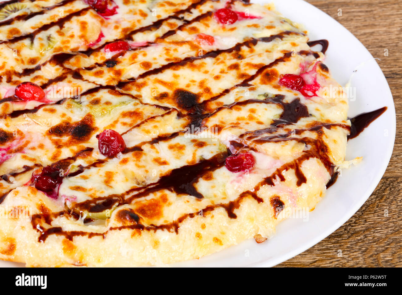 Sweet pizza with fruits and mozzarella Stock Photo - Alamy