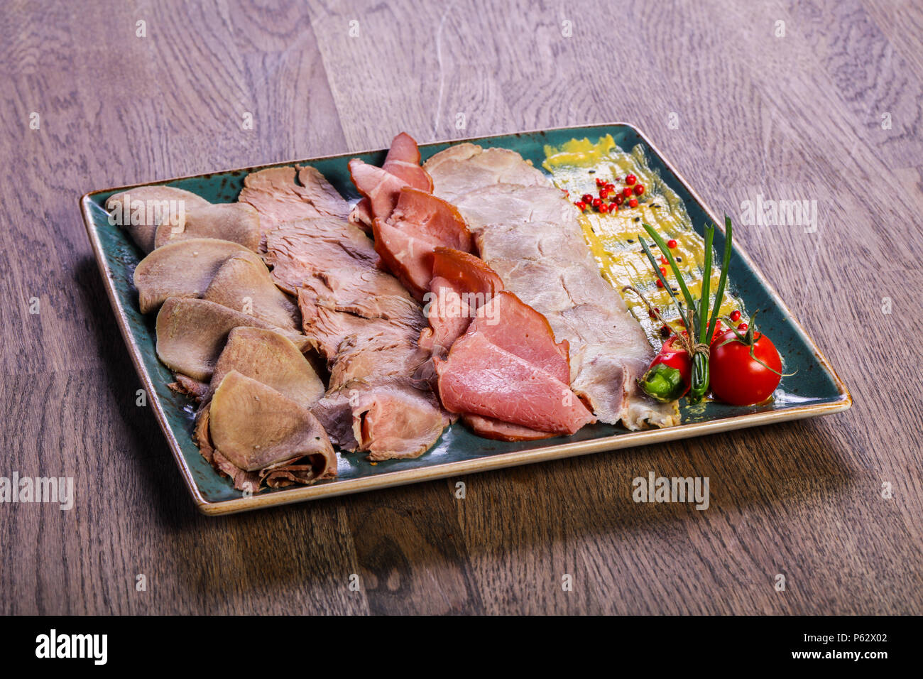 Pork meat plate snack assortment Stock Photo - Alamy