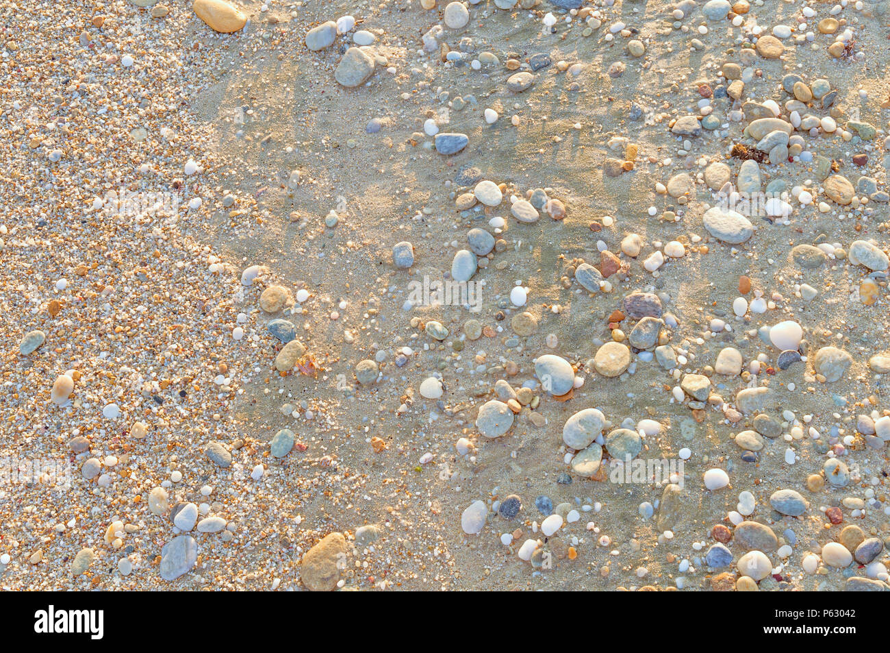 Naturally rounded gravel at sea shore, nature sea background texture ...