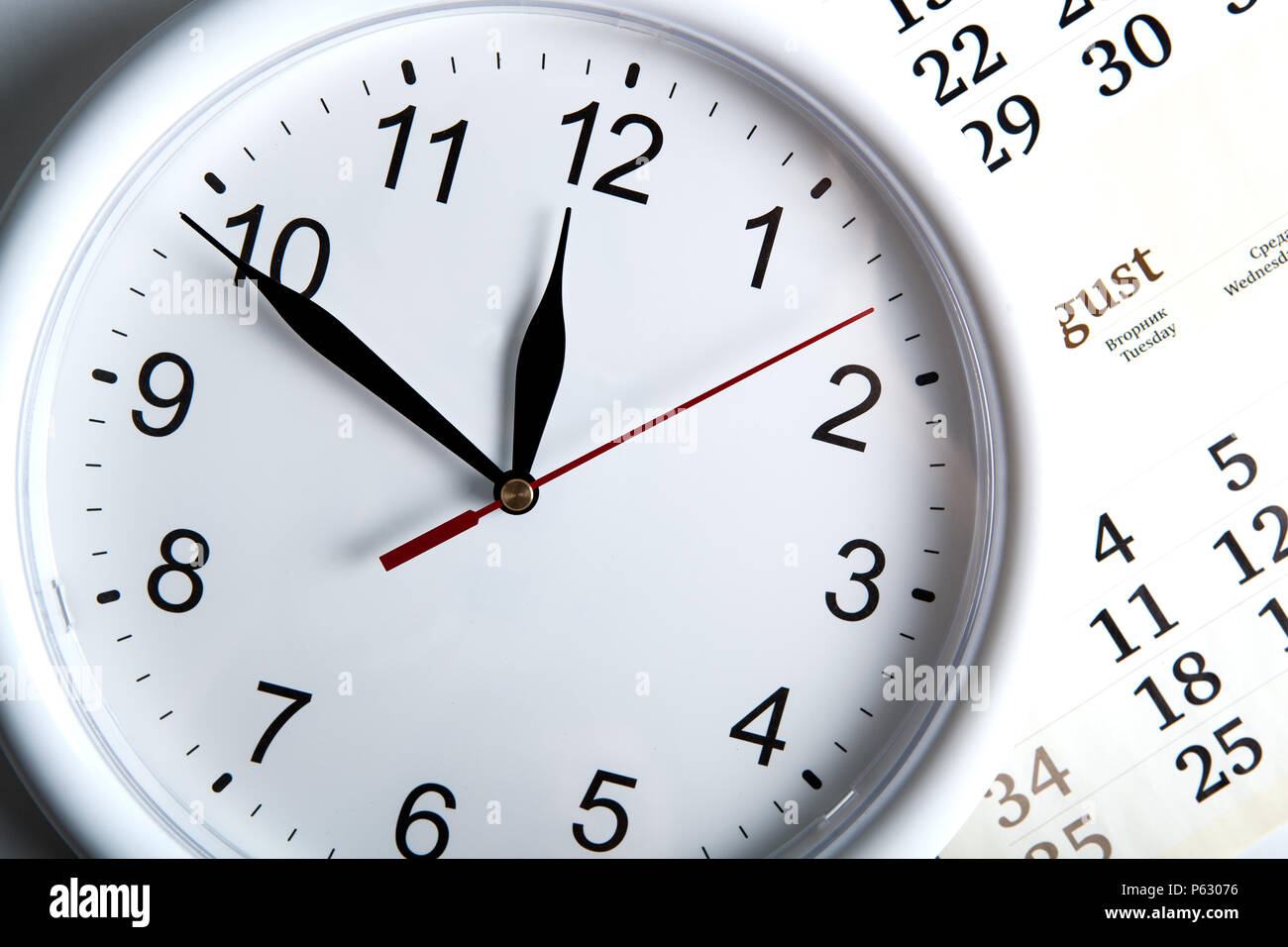 sheet of a calendar with the number of days and clock Stock Photo - Alamy