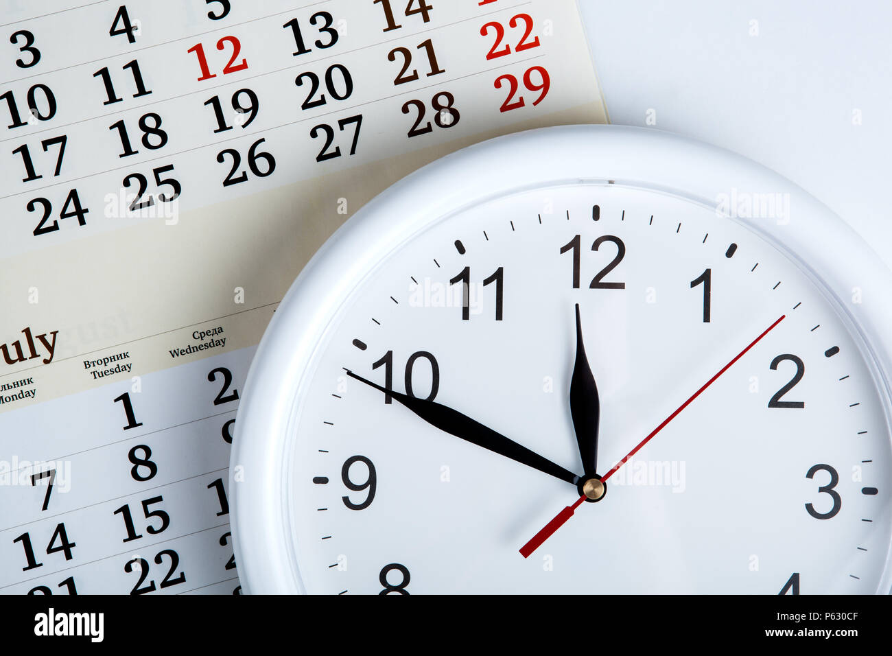 sheet of a calendar with the number of days and clock Stock Photo - Alamy