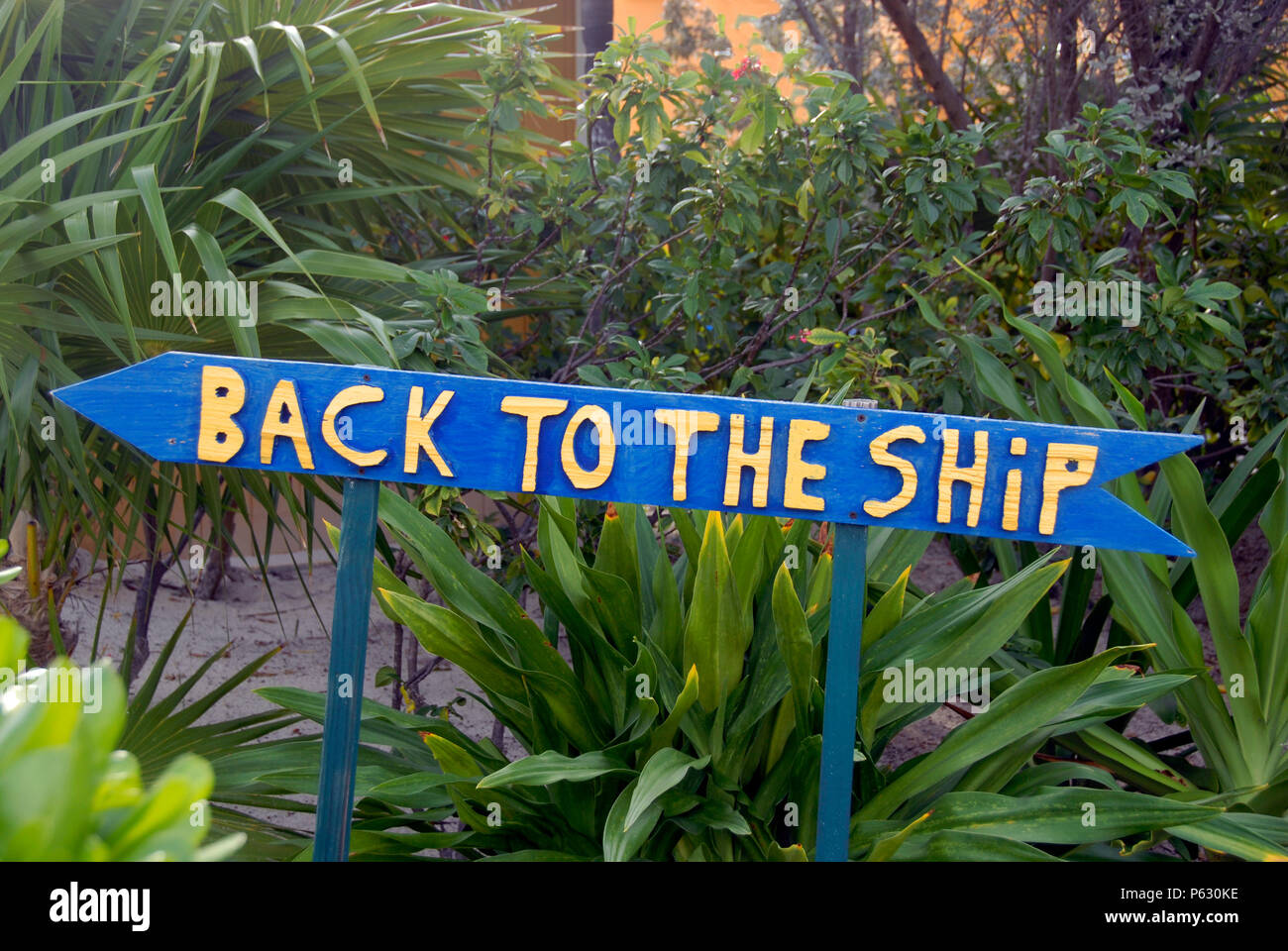 Brightly painted sign with arrow pointing the way back to the ship ...
