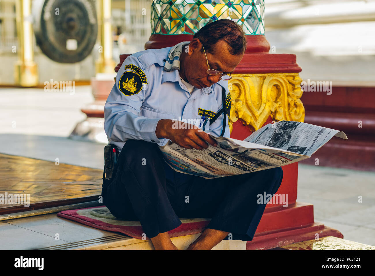Yangon, Myanmar - FEB 19th 2014: Burmese male police are reading ...