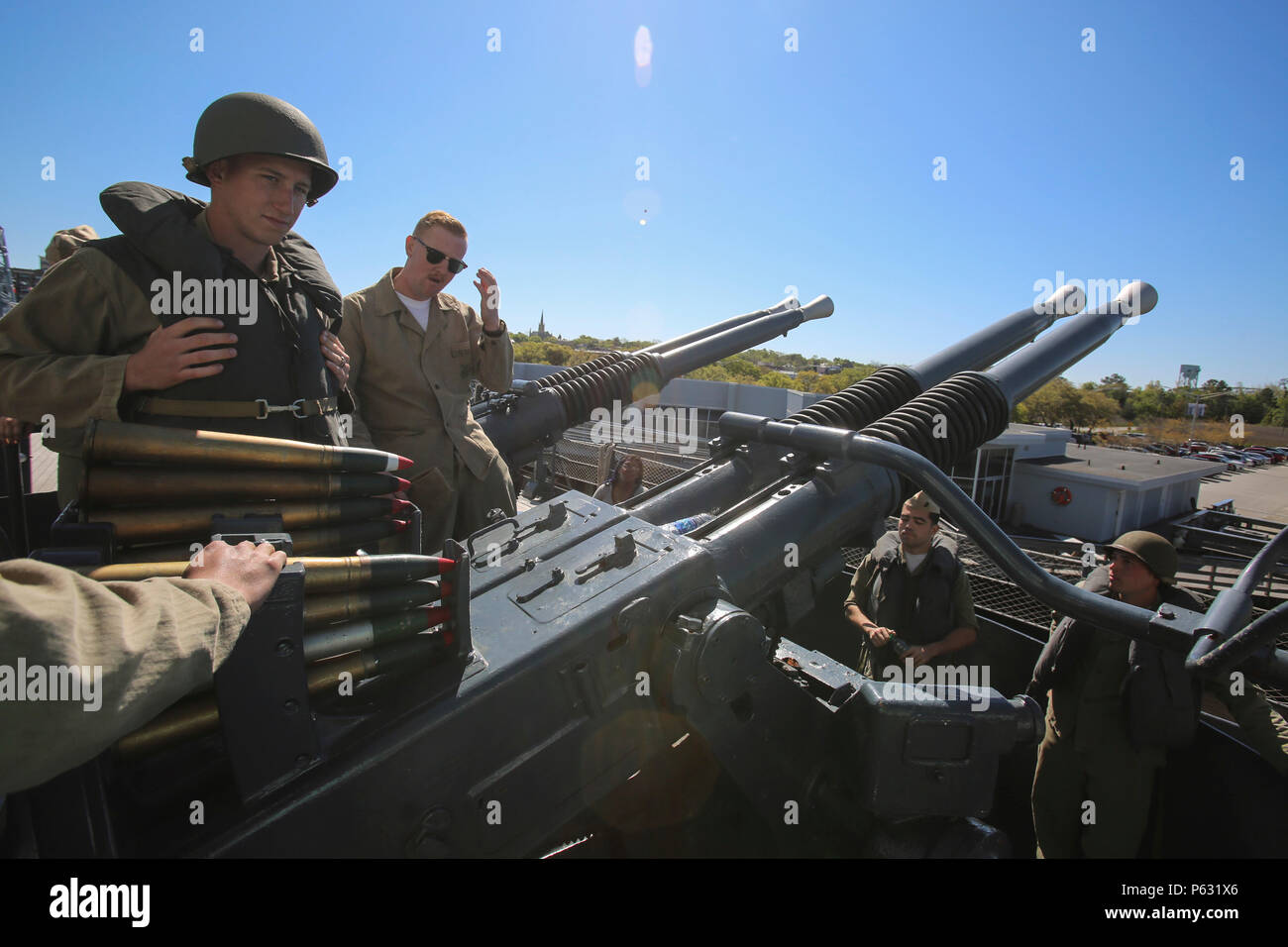 Marines with 2nd Tank Battalion demonstrate how to operate the 40mm/.56 ...