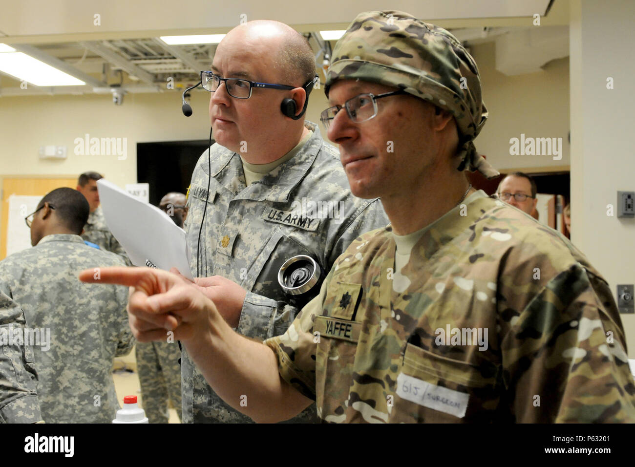 U.S. Army Reserve Maj. John Laymon (left) observes as Lt. Col. Michael ...