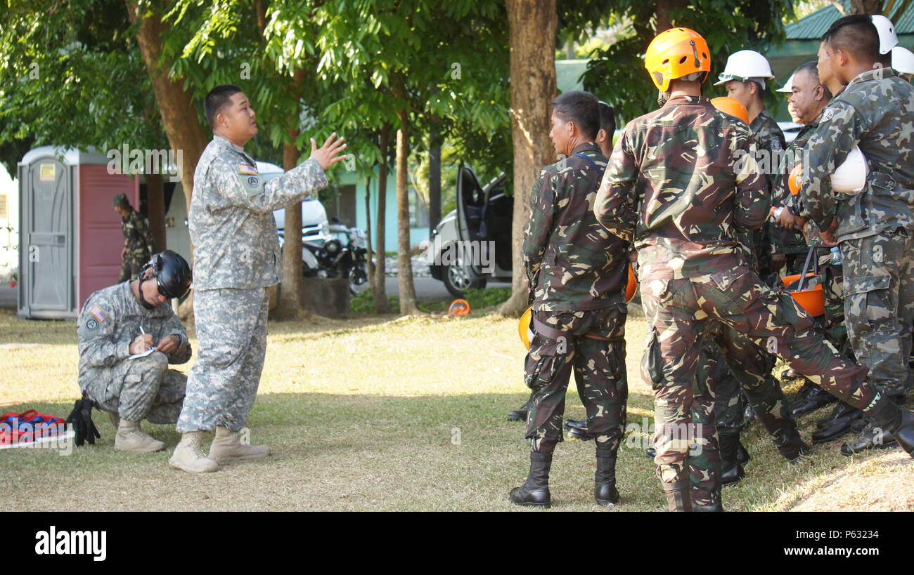 Staff Sgt. Cory Ito, Hawaii National Guard CERFP team, collects an ...