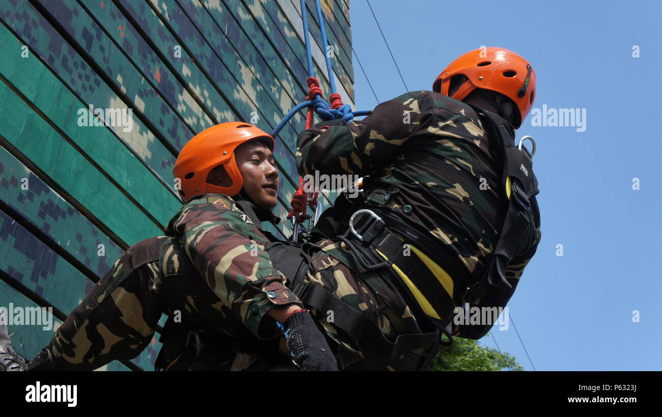 Members of the Armed Forces of the Philippines demonstrate a rescue ...