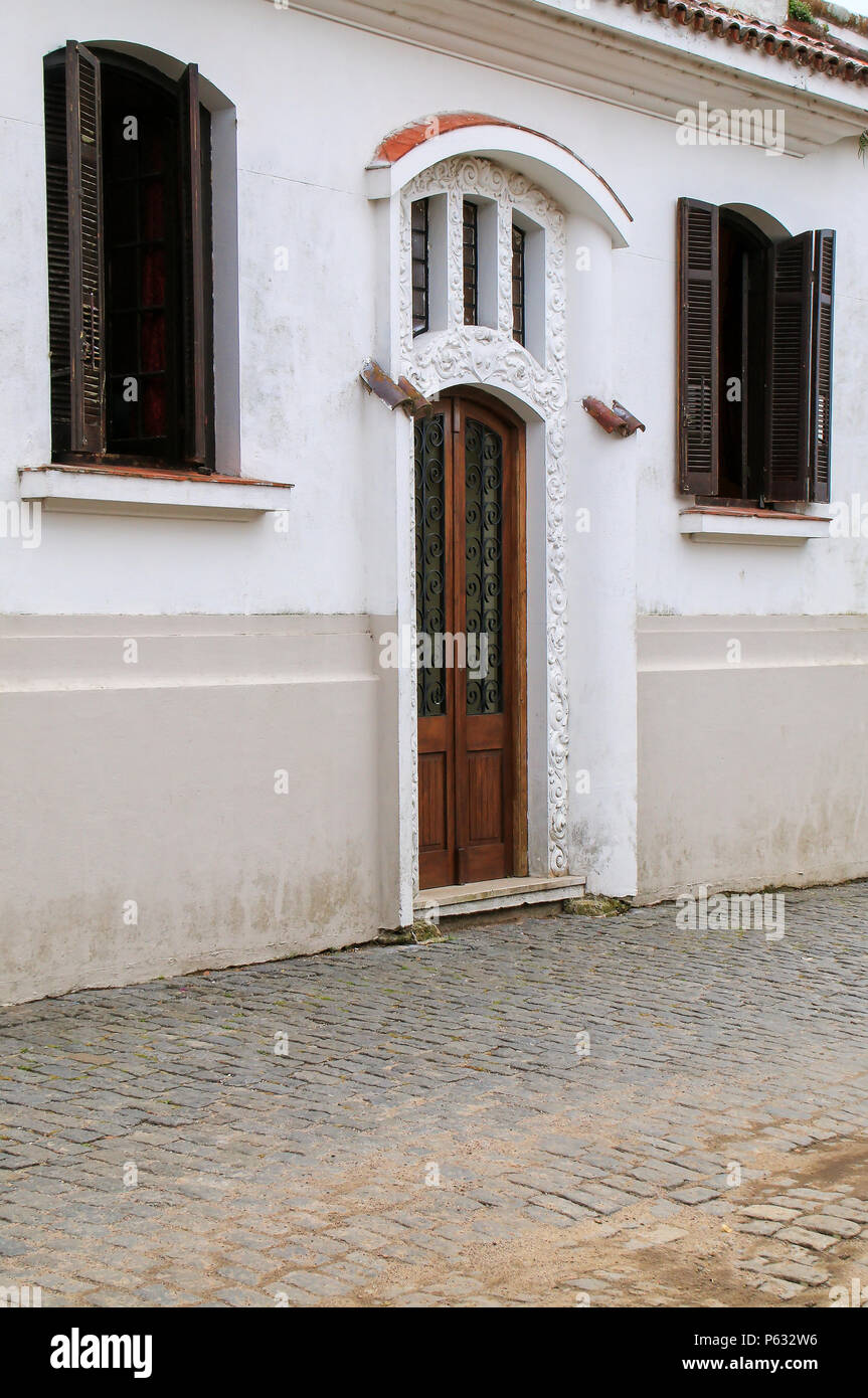 Close view of white colonial house in historic quarter of Colonia del ...