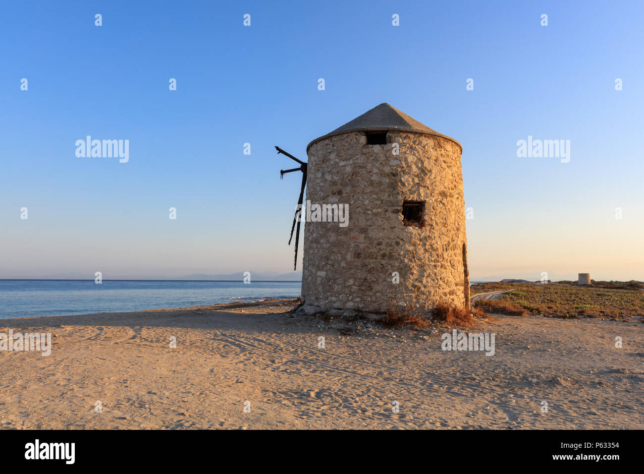 Old windmill in Gyra beach, Lefkada Greece Stock Photo - Alamy