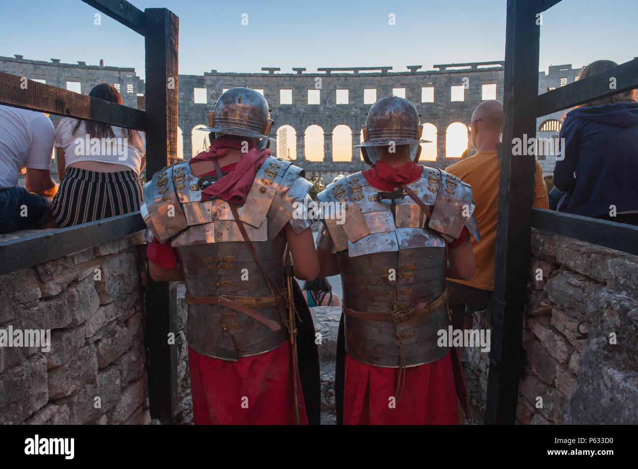 Actors dressed as Roman soldiers watch a gladiator themed show at the ...