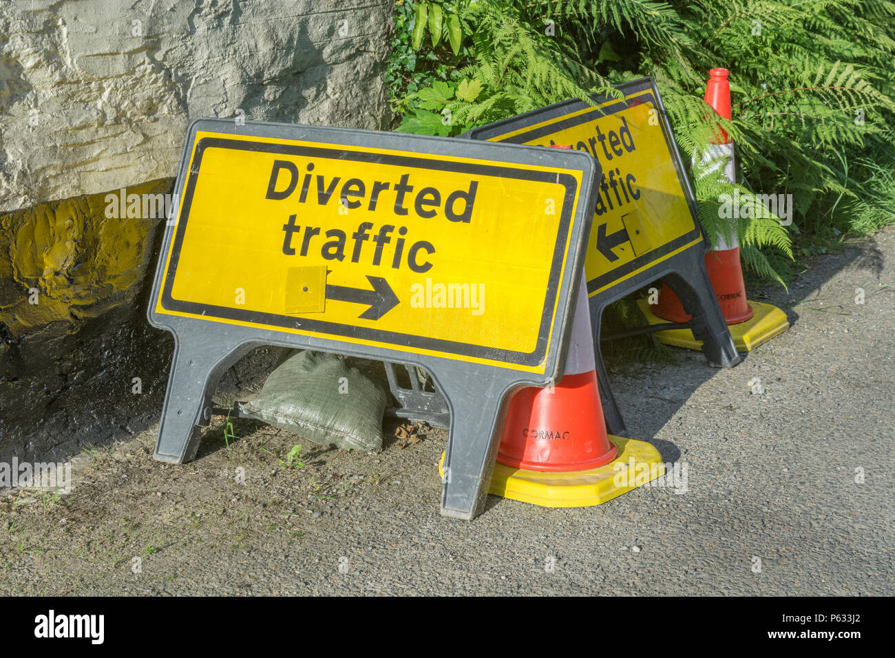 Yellow 'Diverted Traffic' sign. Temporary road closure concept, and ...