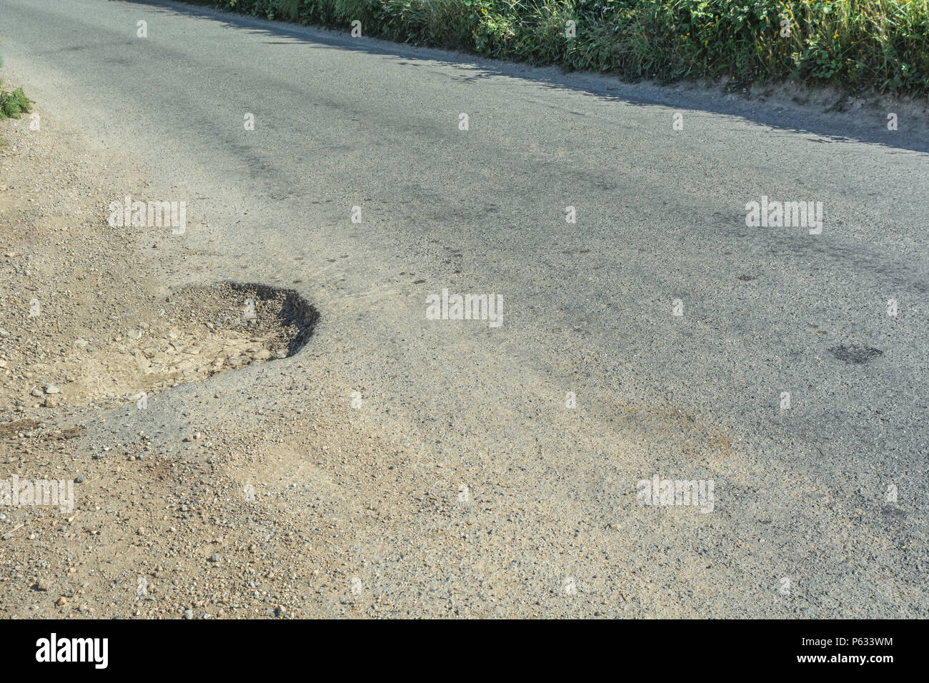 Damaged tarmac on roads hi-res stock photography and images - Alamy