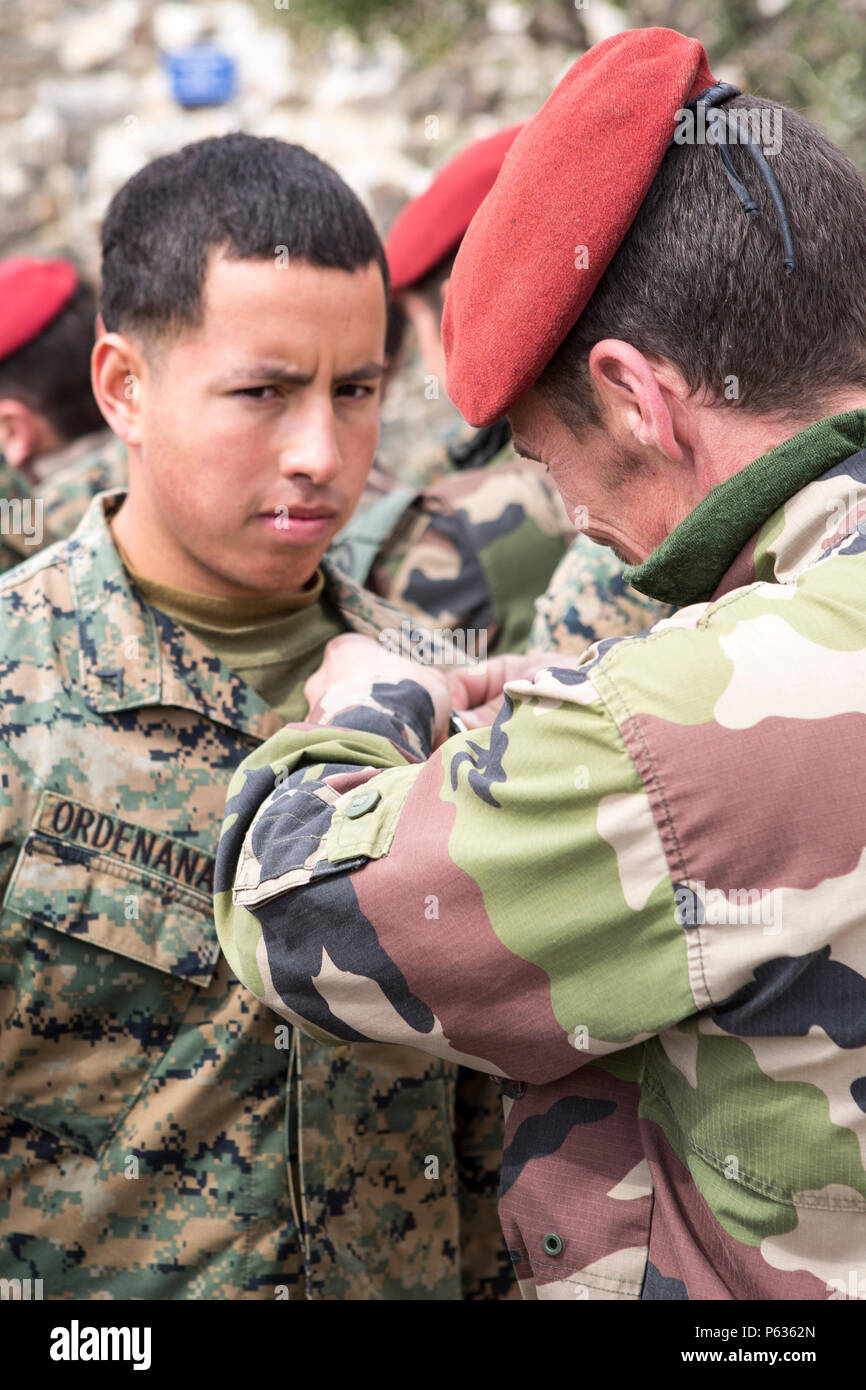 A French Commando training instructor places a French Commando pin on U ...