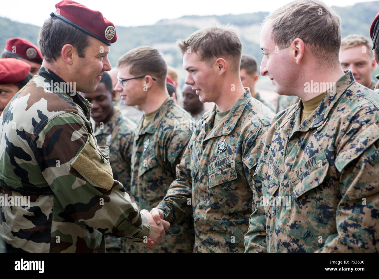 A French Commando training instructor congratulates U.S. Marines with ...
