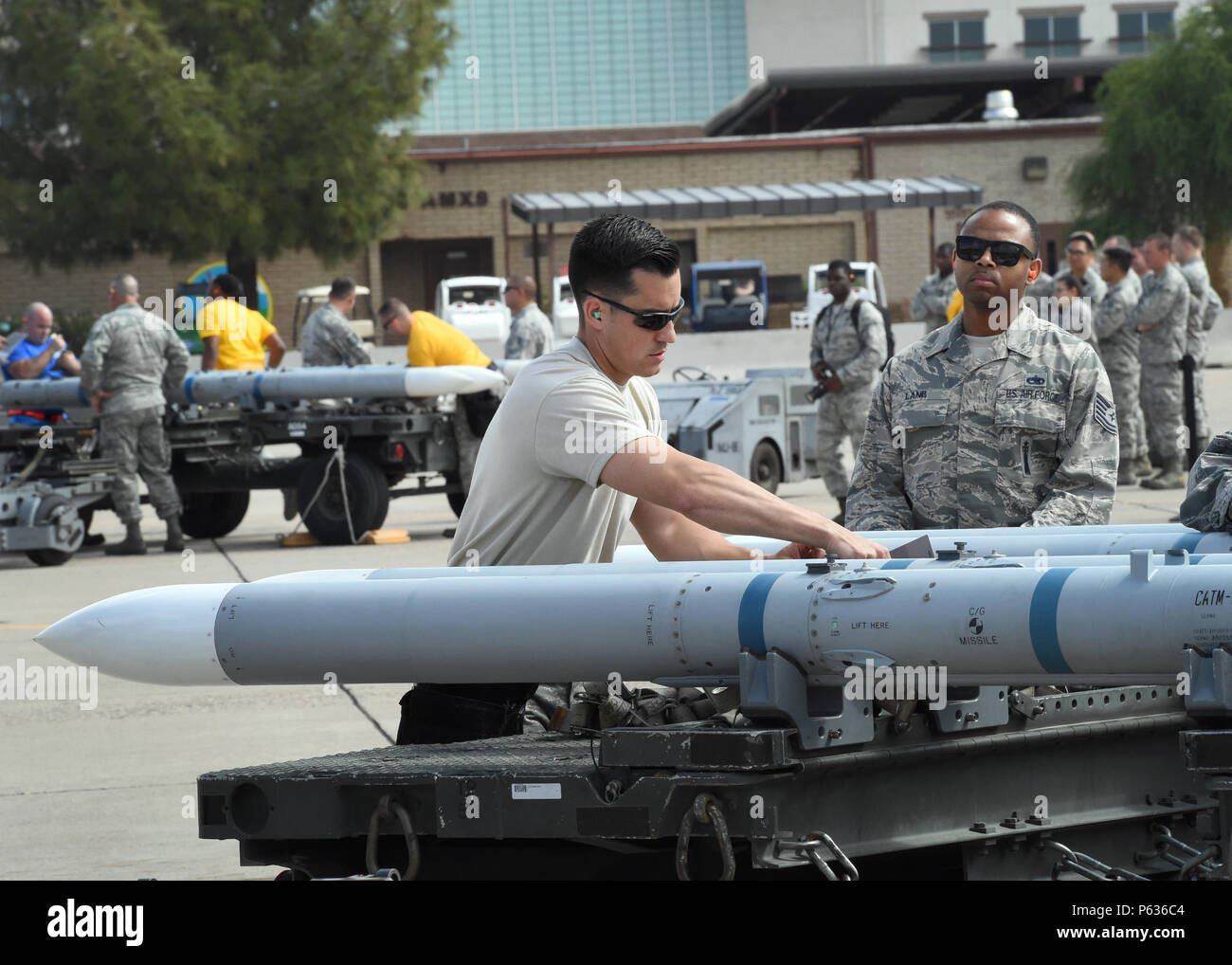Tech. Sgt. Leroy Lane (right), a weapons standardization loading crew ...