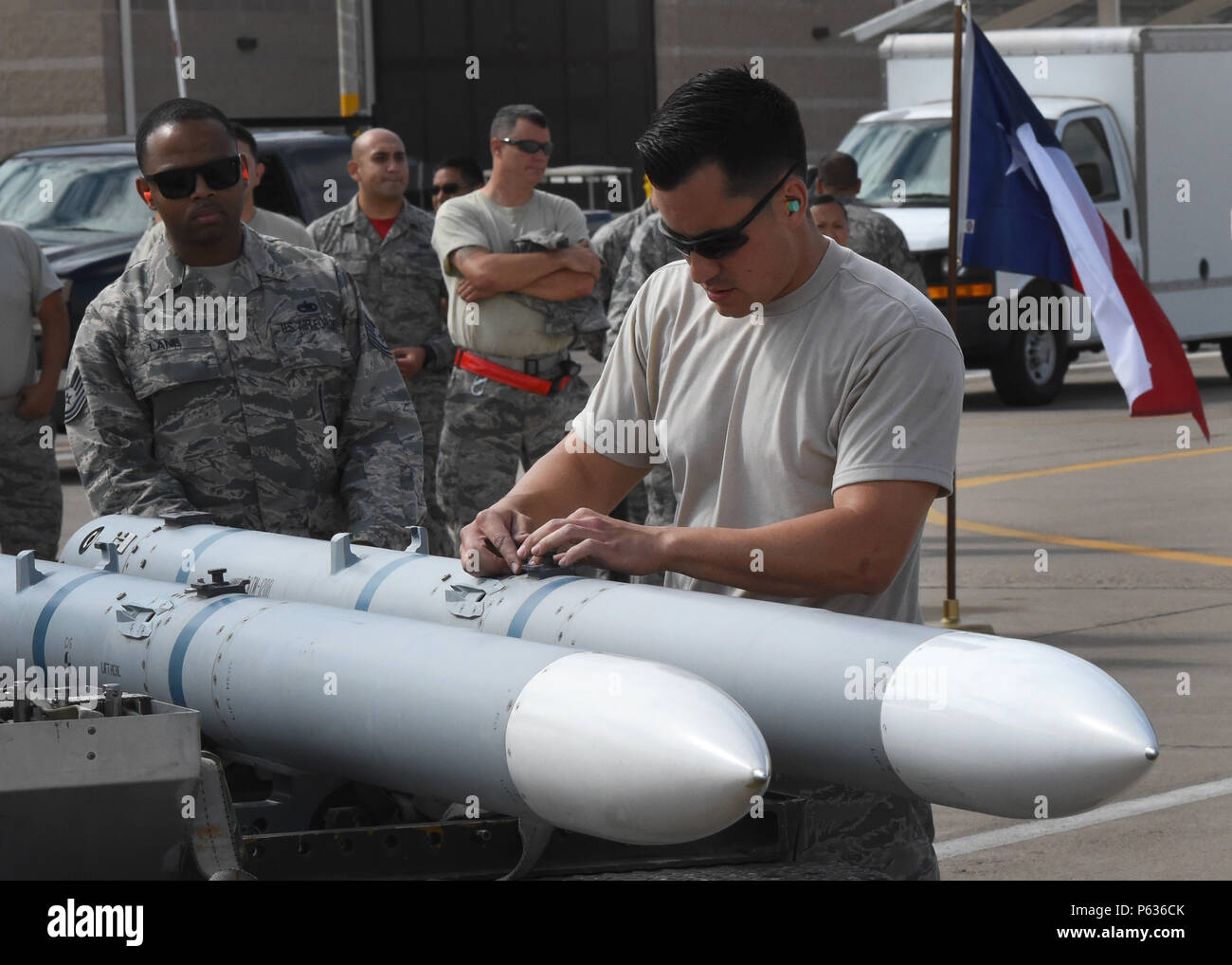 Tech. Sgt. Leroy Lane (left), a weapons standardization loading crew ...