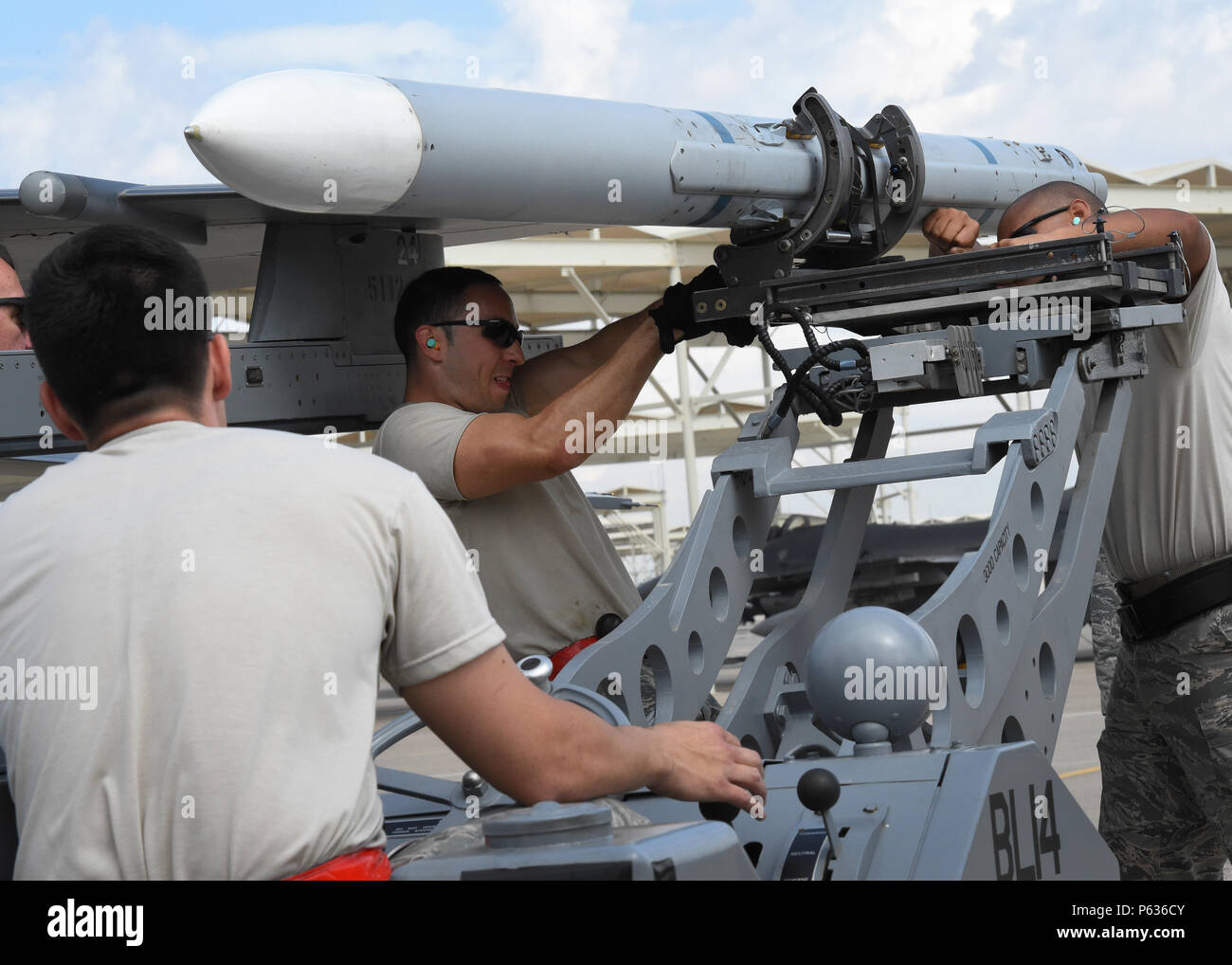 Tech. Sgt. Mark Nash (right), Tech. Sgt. Federico Barrios (center) and ...