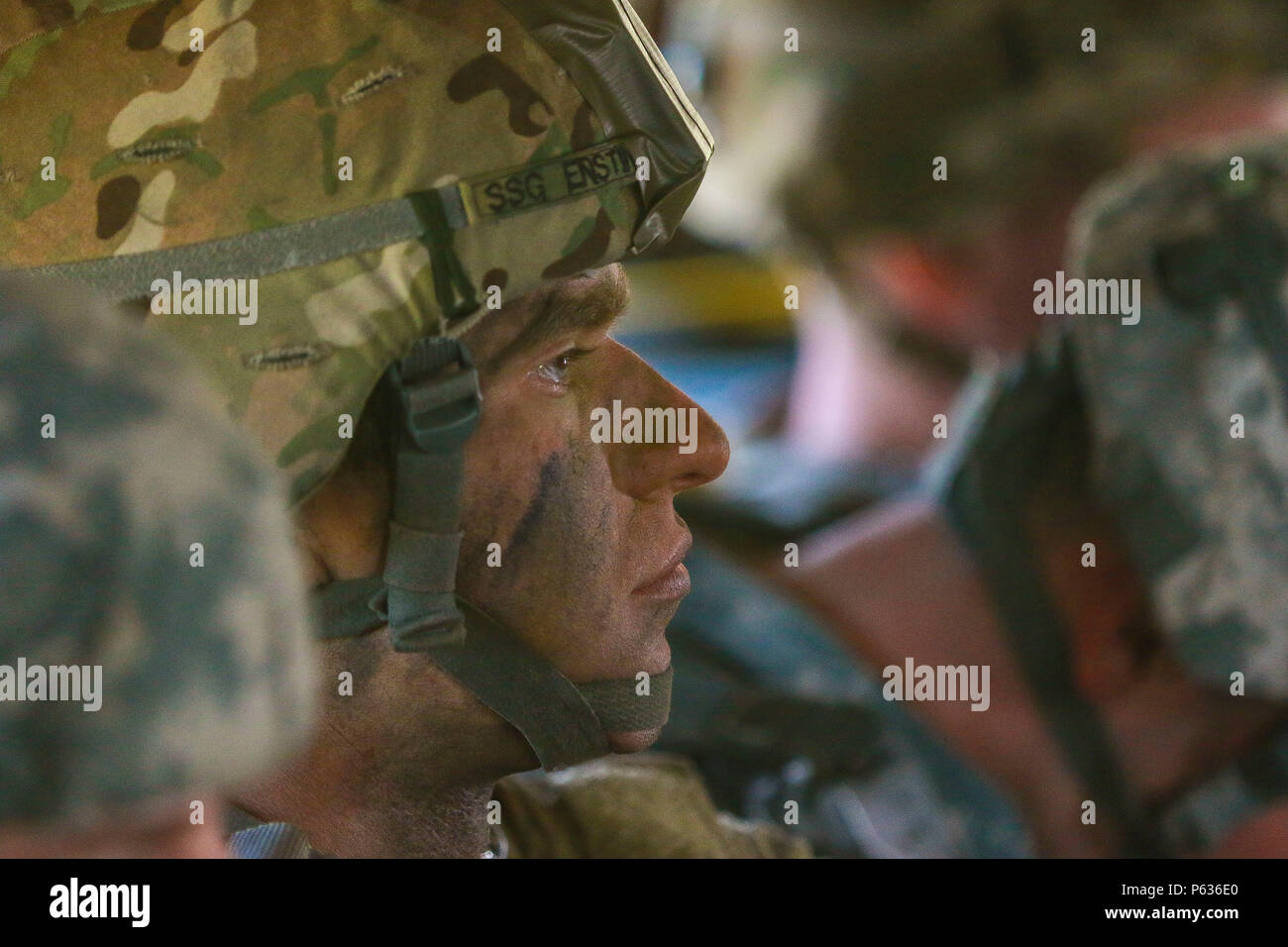 The camoflauged face of Staff Sgt. Everett Enstine, cavalry scout, 5th ...
