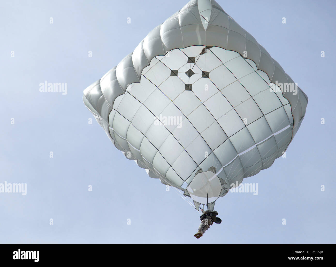 A paratrooper from Fort Bragg, N.C., performs a static line jump during ...