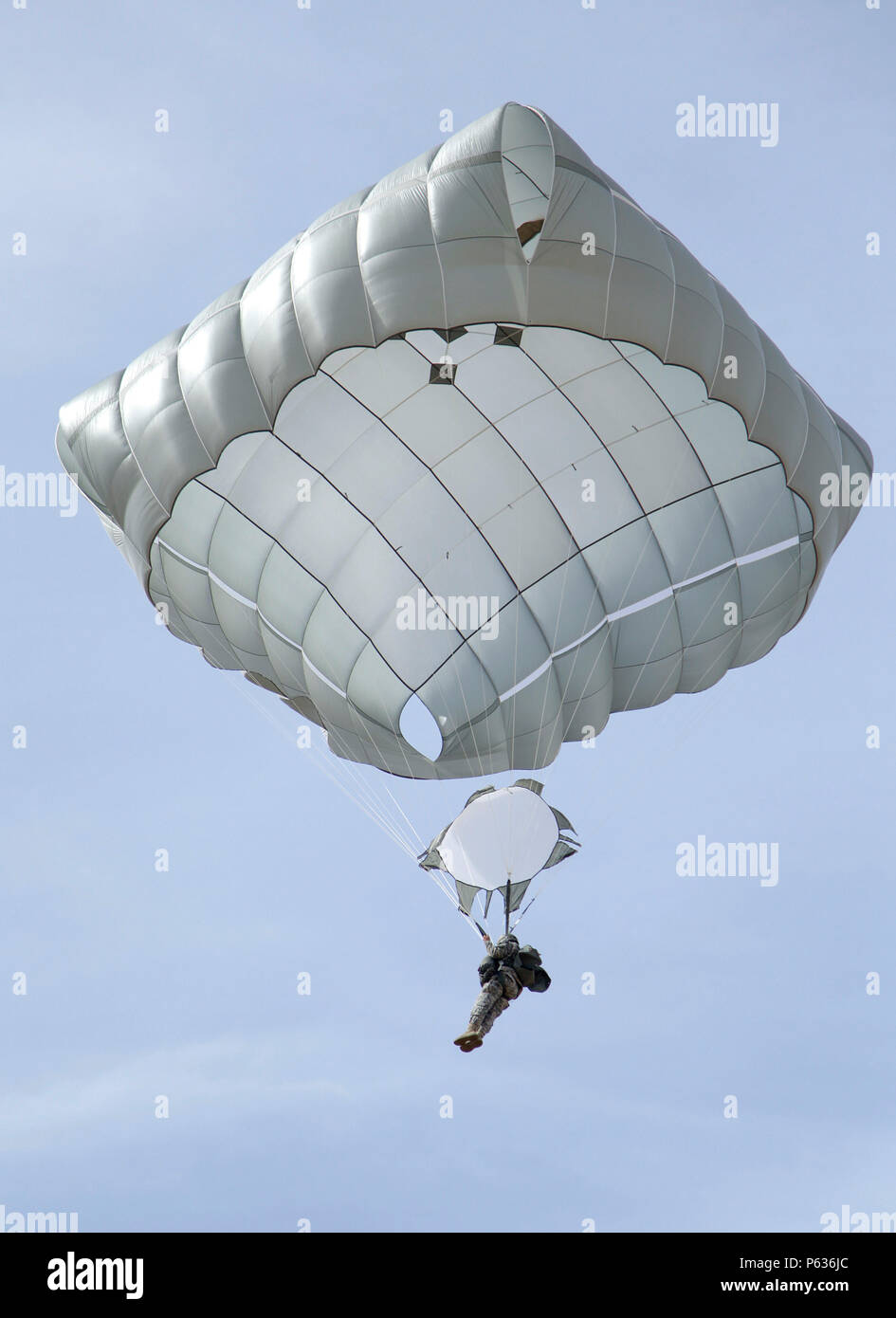 A paratrooper from Fort Bragg, N.C., performs a static line jump during ...