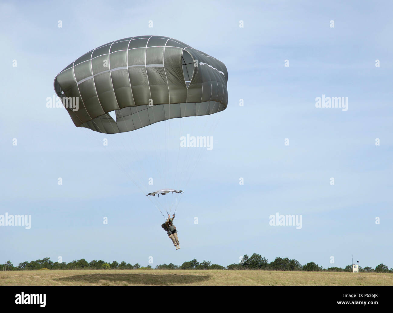 A paratrooper from Fort Bragg, N.C., performs a static line jump during ...