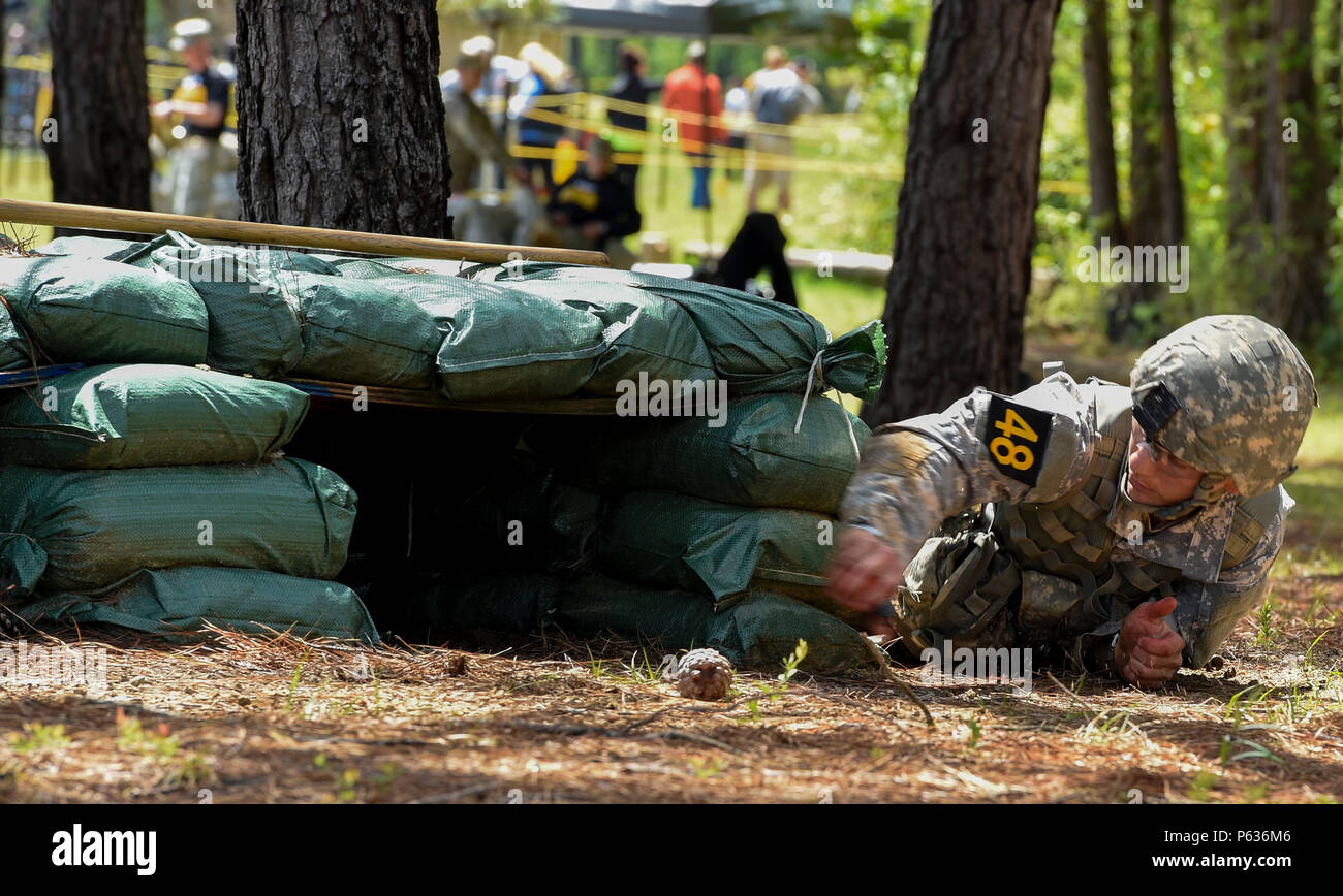U.S. Army Sgt. 1st Class Troy Conrad, National Guard Ranger, tosses a ...