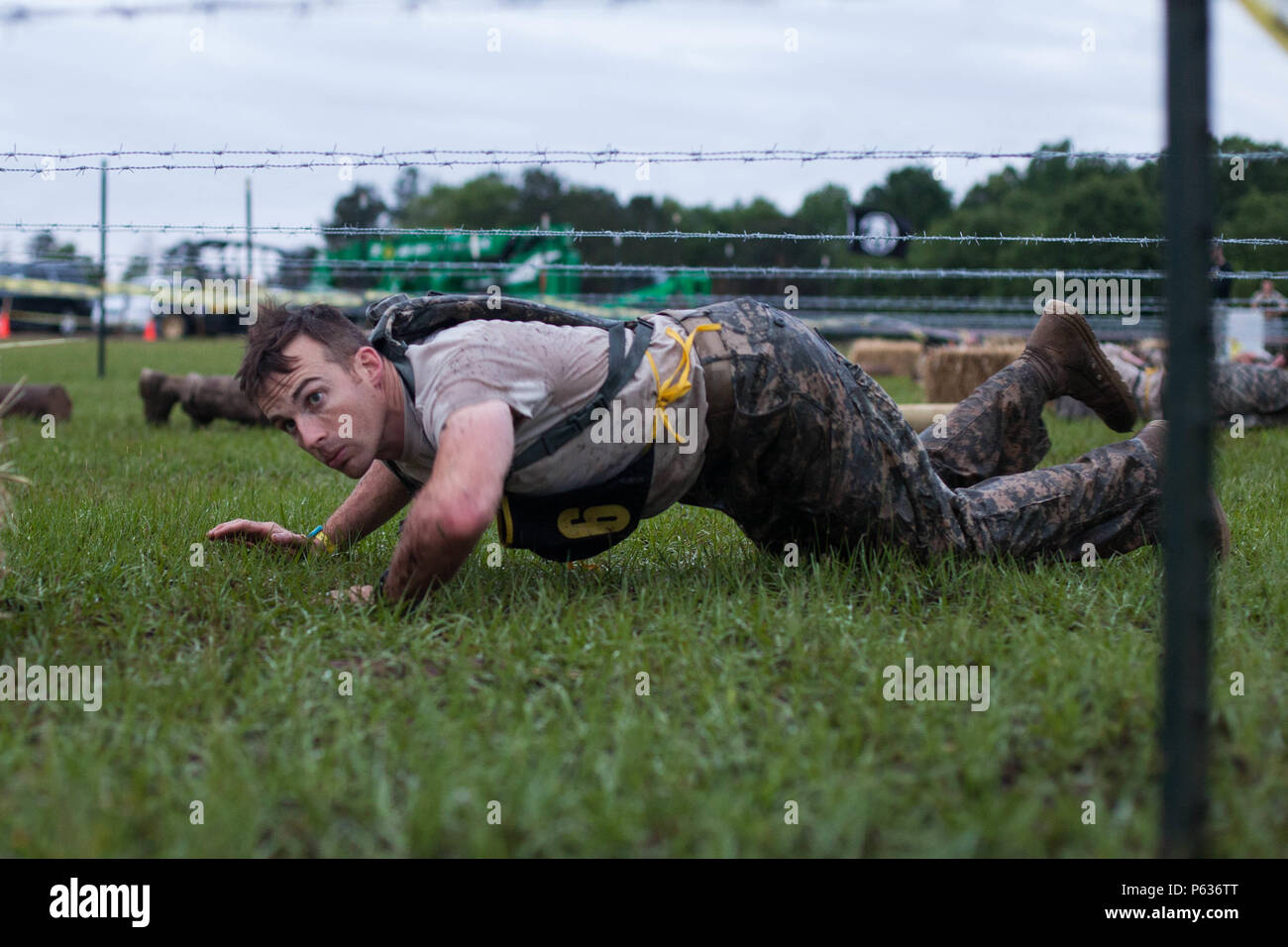 U.S. Army Ranger, Capt. Bert Ferguson, 7th Special Forces Group, crawls ...