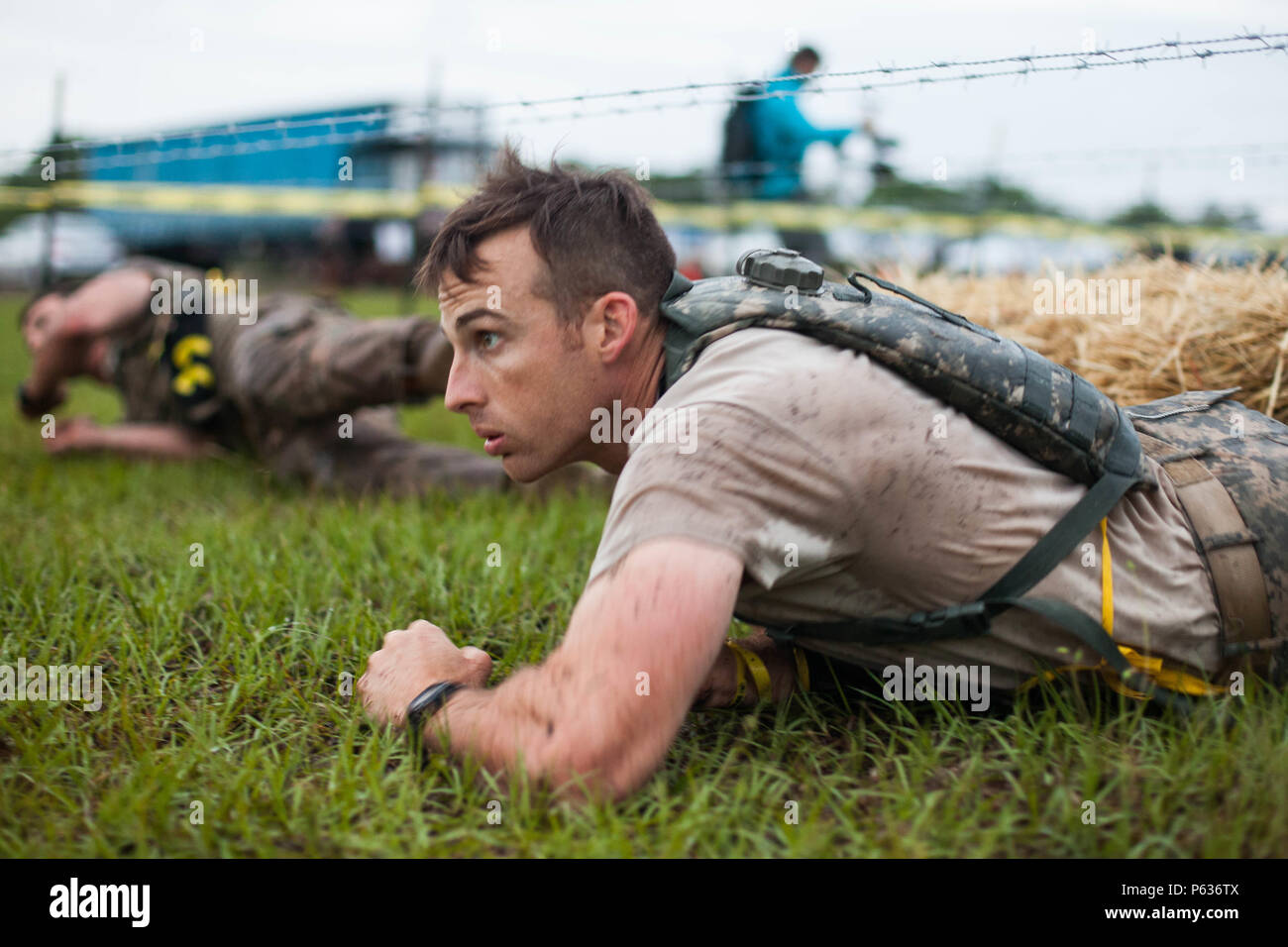 U.S. Army Ranger, Capt. Bert Ferguson, 7th Special Forces Group, crawls ...