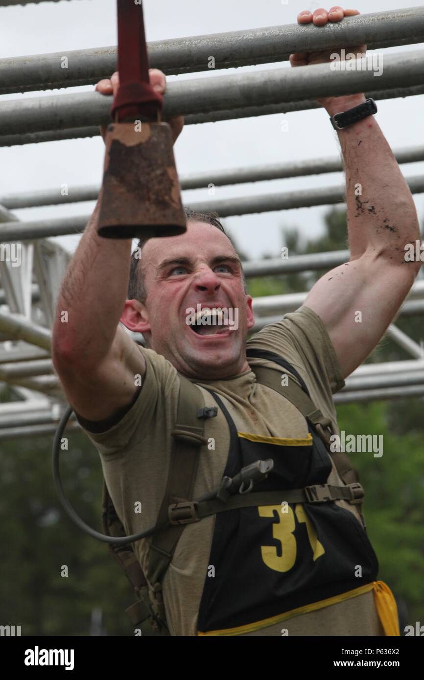U.S. Army Ranger traverses the monkey bars at the Spartan Race during ...