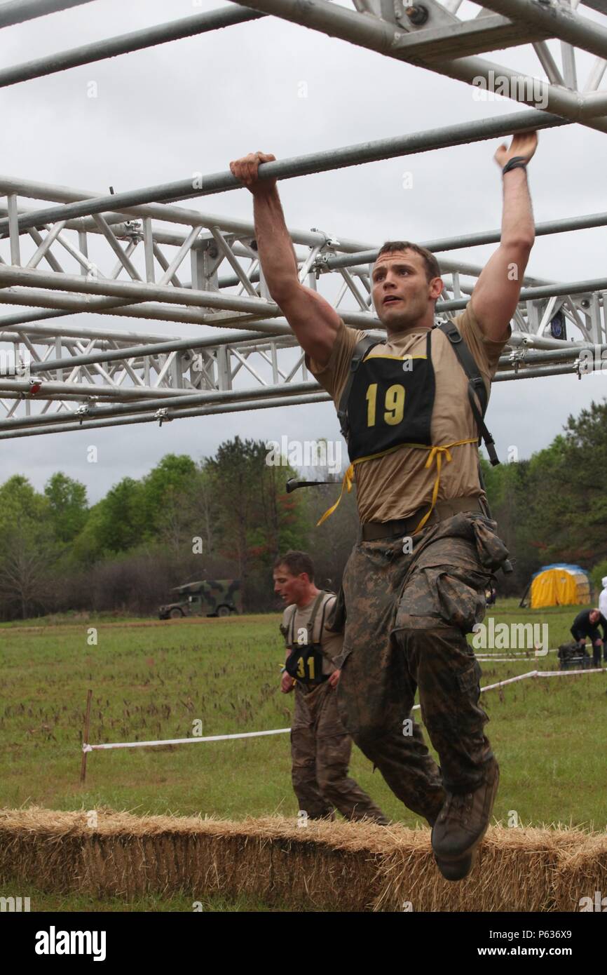 A U.S. Army Ranger traverses the monkey bars at the Spartan Race during ...