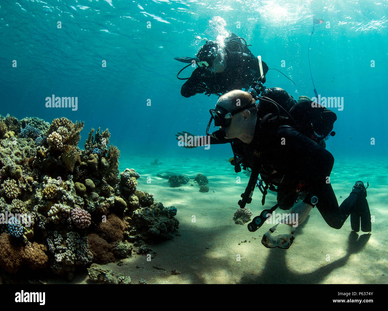 Capt. Kyle Moses, commodore of Commander, Task Force (CTF) 56, left ...