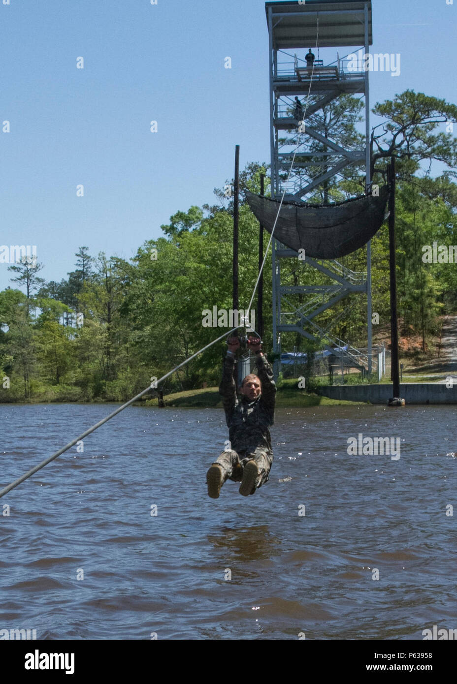 A U.S. Army Ranger slides down a zip line before dropping into Victory ...