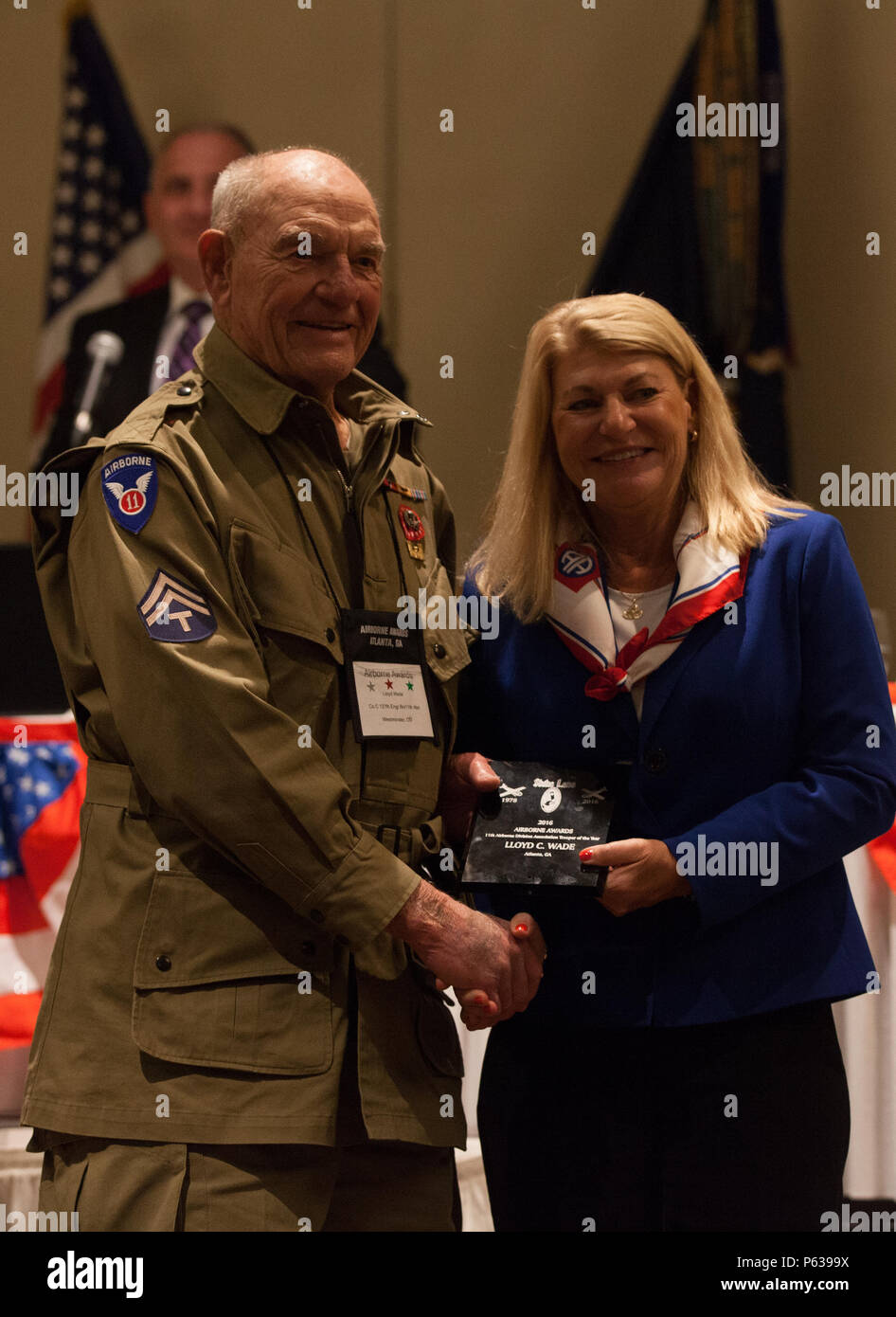 U.S. Army Technician 5th Grade (Ret.) Lloyd Wade accepts an award for ...