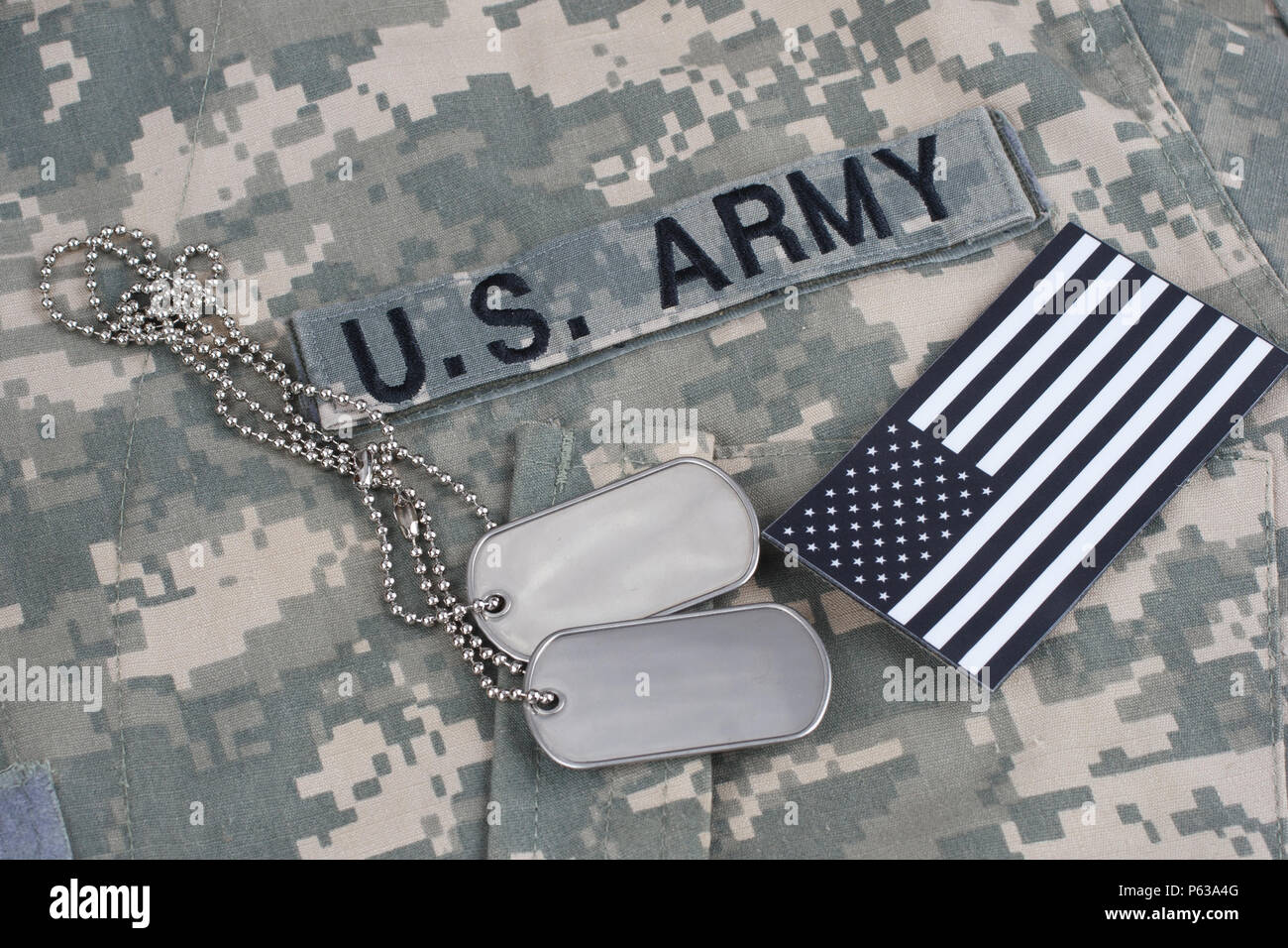 US flag patch with dog tag on Army Combat Uniform background Stock ...