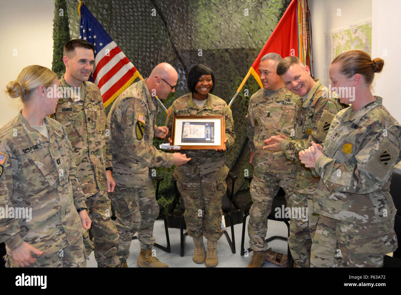 Spc. Samantha Manadoum (center), a medic with 3rd Brigade Support ...