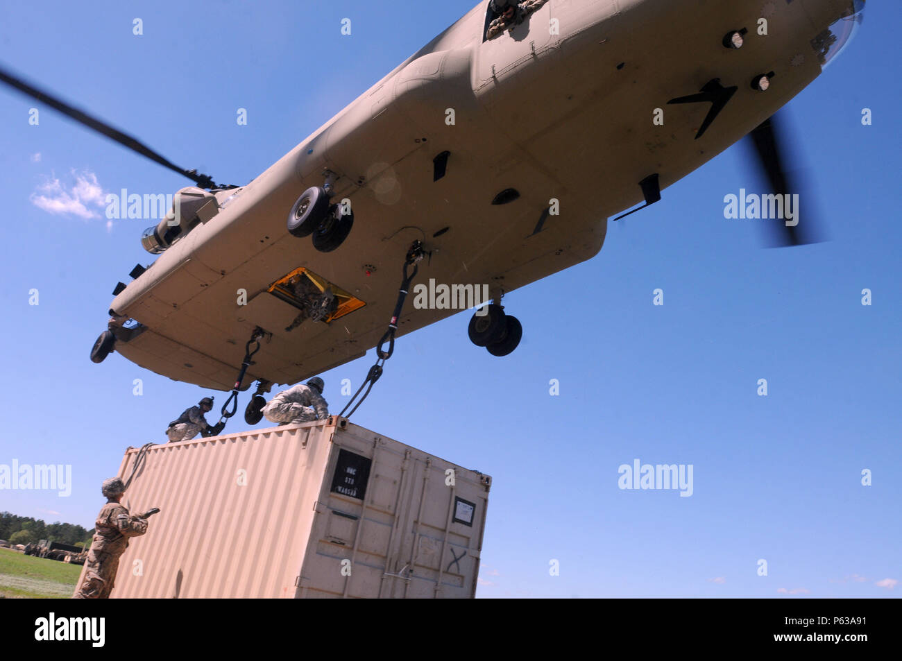 Soldiers attached to 3rd Infantry Division Sustainment Brigade attach a ...